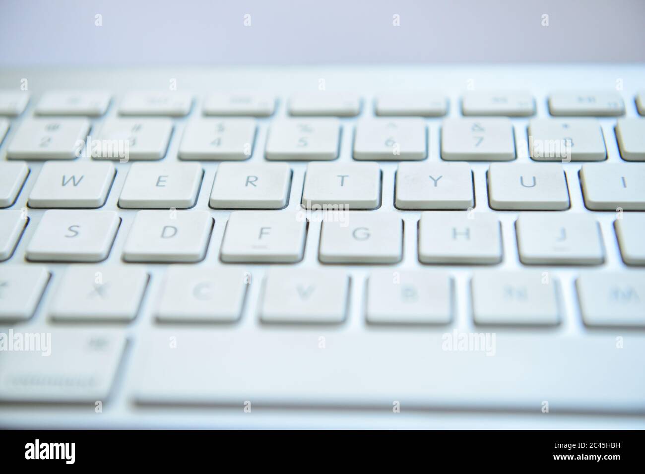 White Aluminum Keyboard with mobile and muse on white background Stock ...