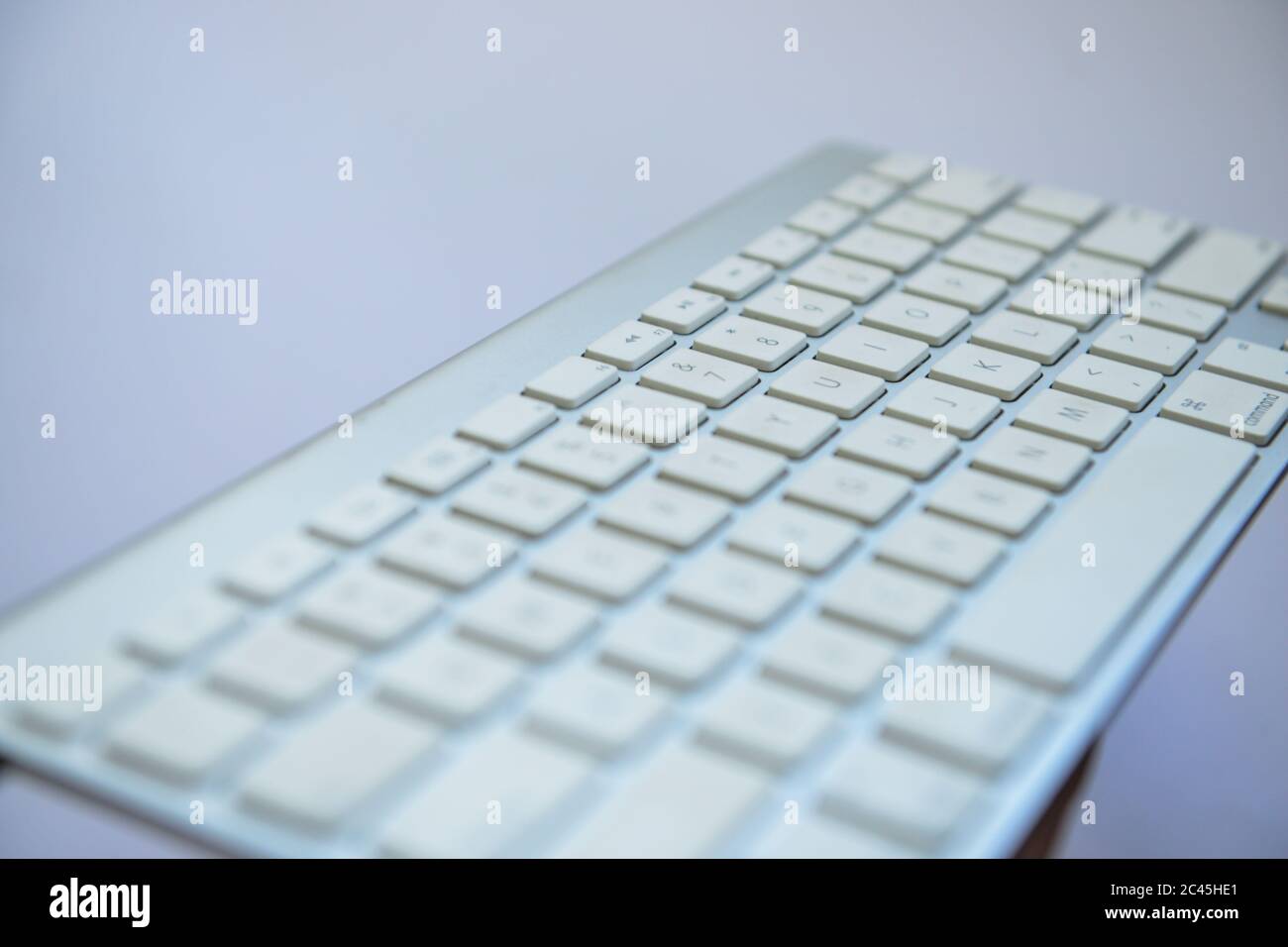 White Aluminum Keyboard with mobile and muse on white background Stock ...