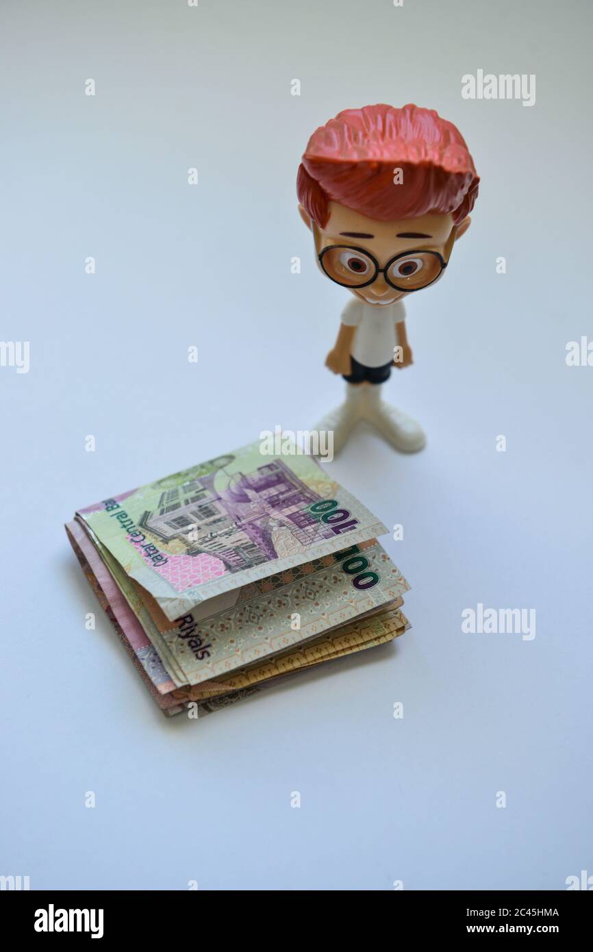 Cool boy Cartoon with Qatari currency on white background Stock Photo ...