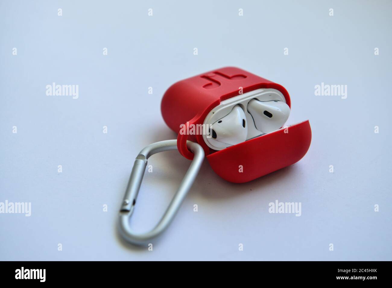 Air Pods in red box Stock Photo - Alamy