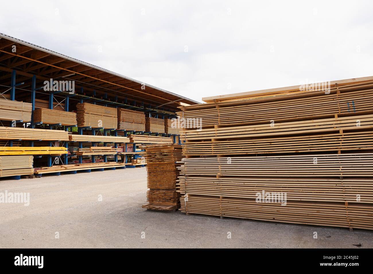 Stack of wooden boards in a sawmill Stock Photo - Alamy