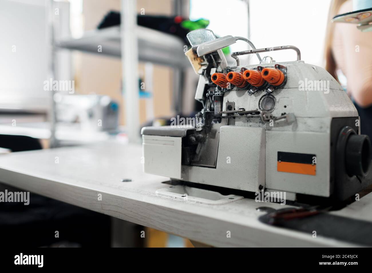 Sewing department of a textile factory interior Stock Photo - Alamy