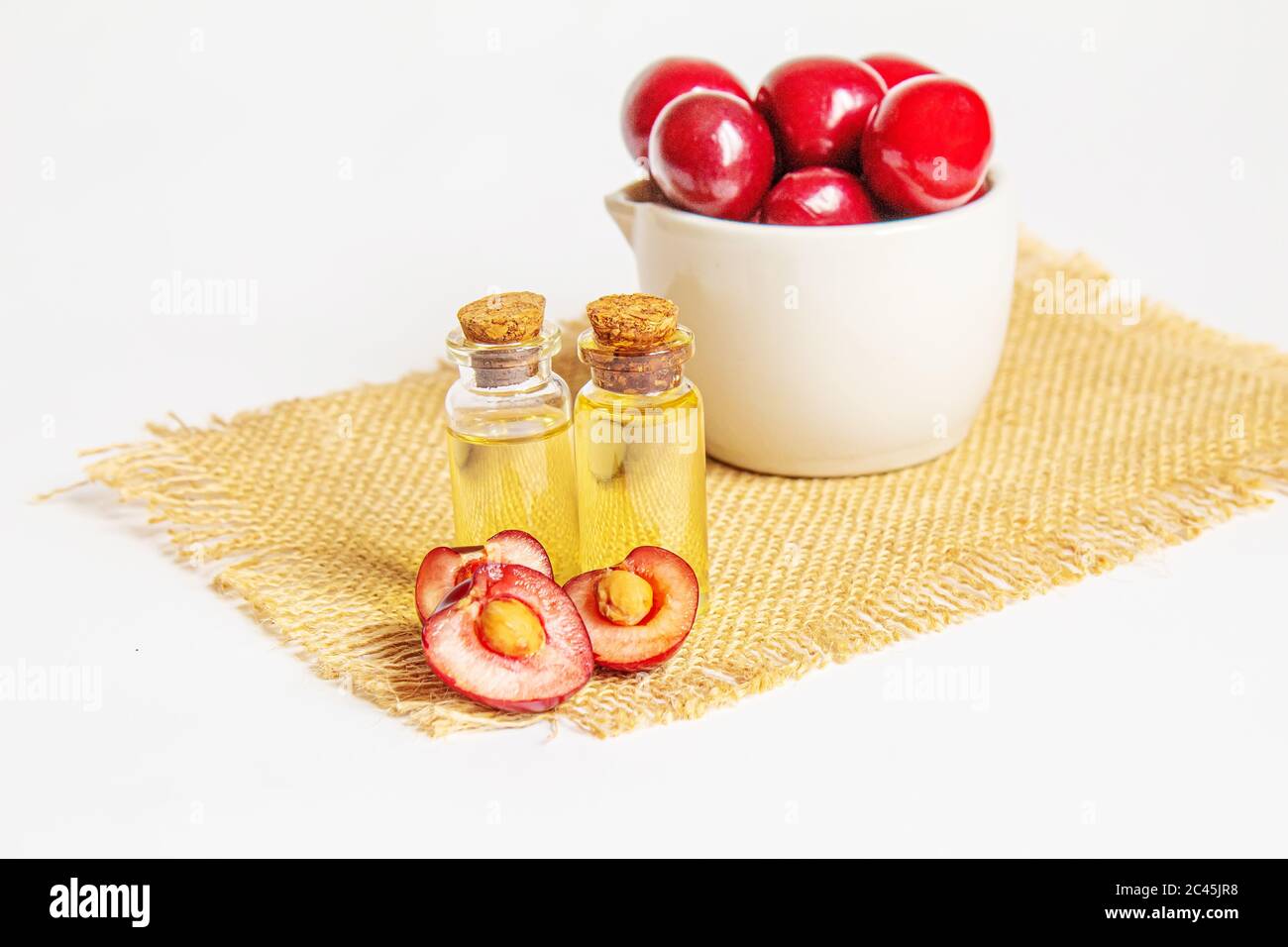 cherry oil in a small jar. selective focus. nature Stock Photo - Alamy