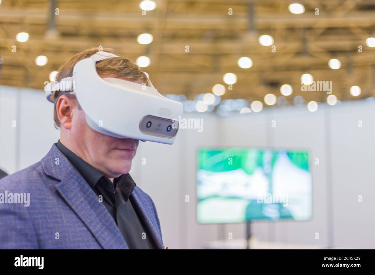 MOSCOW, RUSSIA - March 1, 2019: VR Exhibition. Man using virtual ...