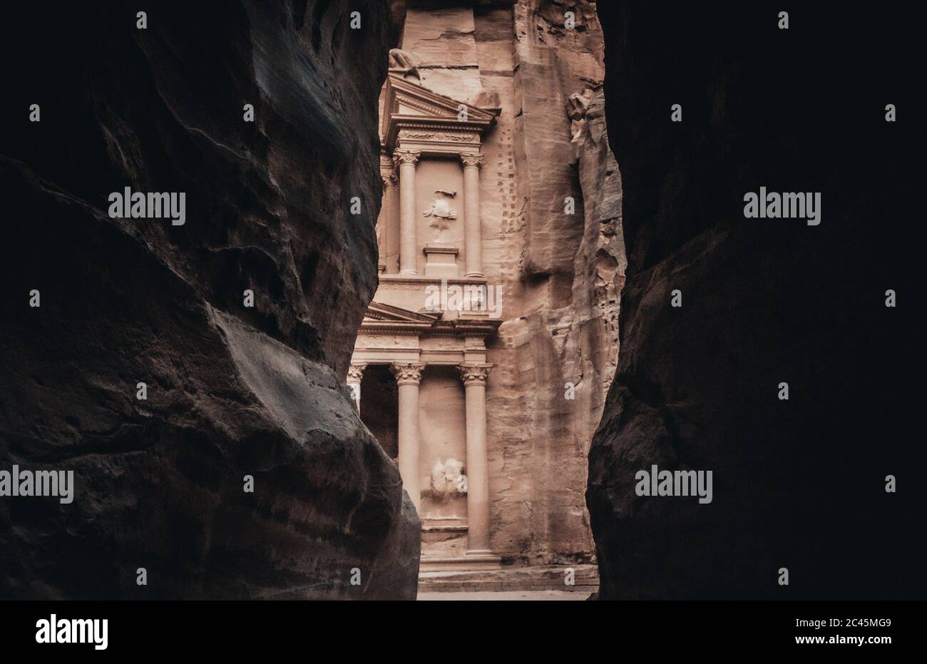 The historic Petra Wadi in Jordan seen behind the huge rocks Stock ...