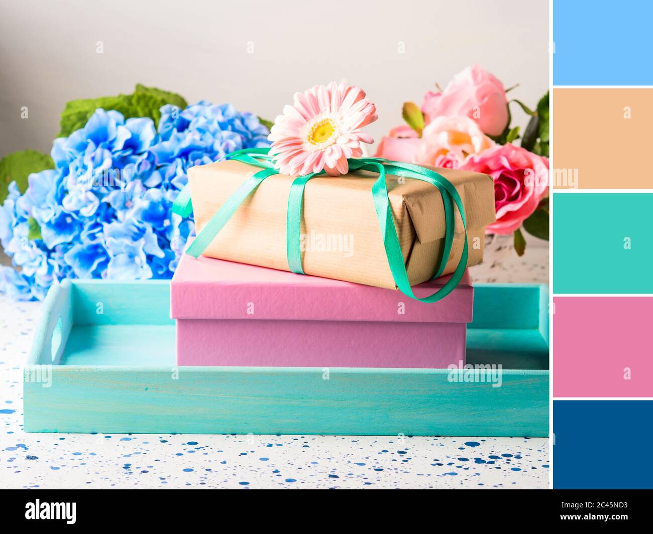 Stacked gift boxes with flowers. Color swatch Stock Photo - Alamy