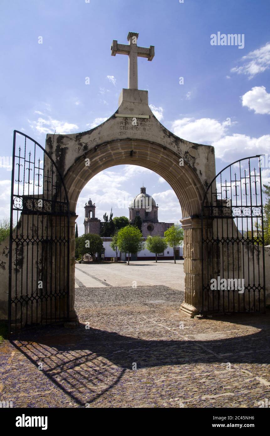 Beautiful shot of an opened gate leading to an entrance of the church ...
