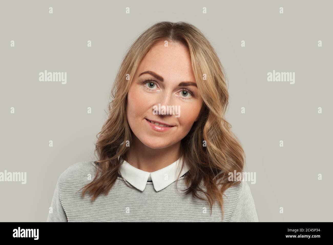 Optimistic woman smiling on white background, portrait Stock Photo - Alamy