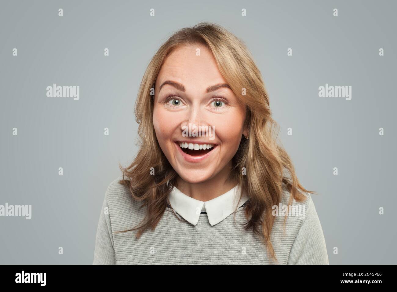 Pretty surprised woman on white background, portrait Stock Photo - Alamy