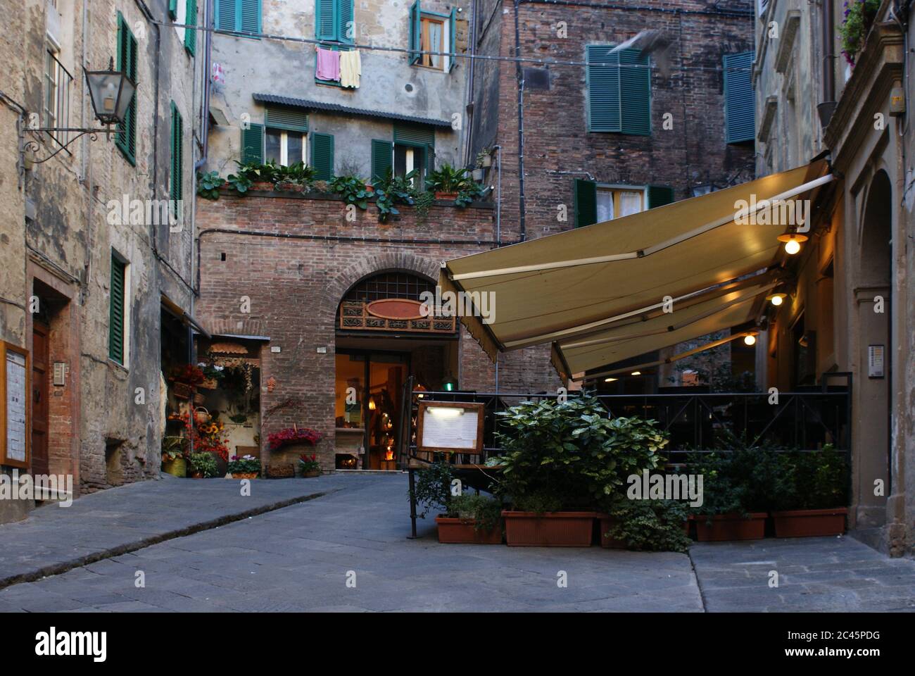 Street cafe in Siena Stock Photo - Alamy