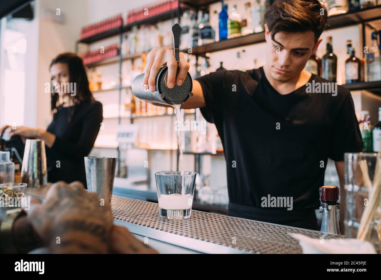 Male staff working behind counter hi-res stock photography and images ...
