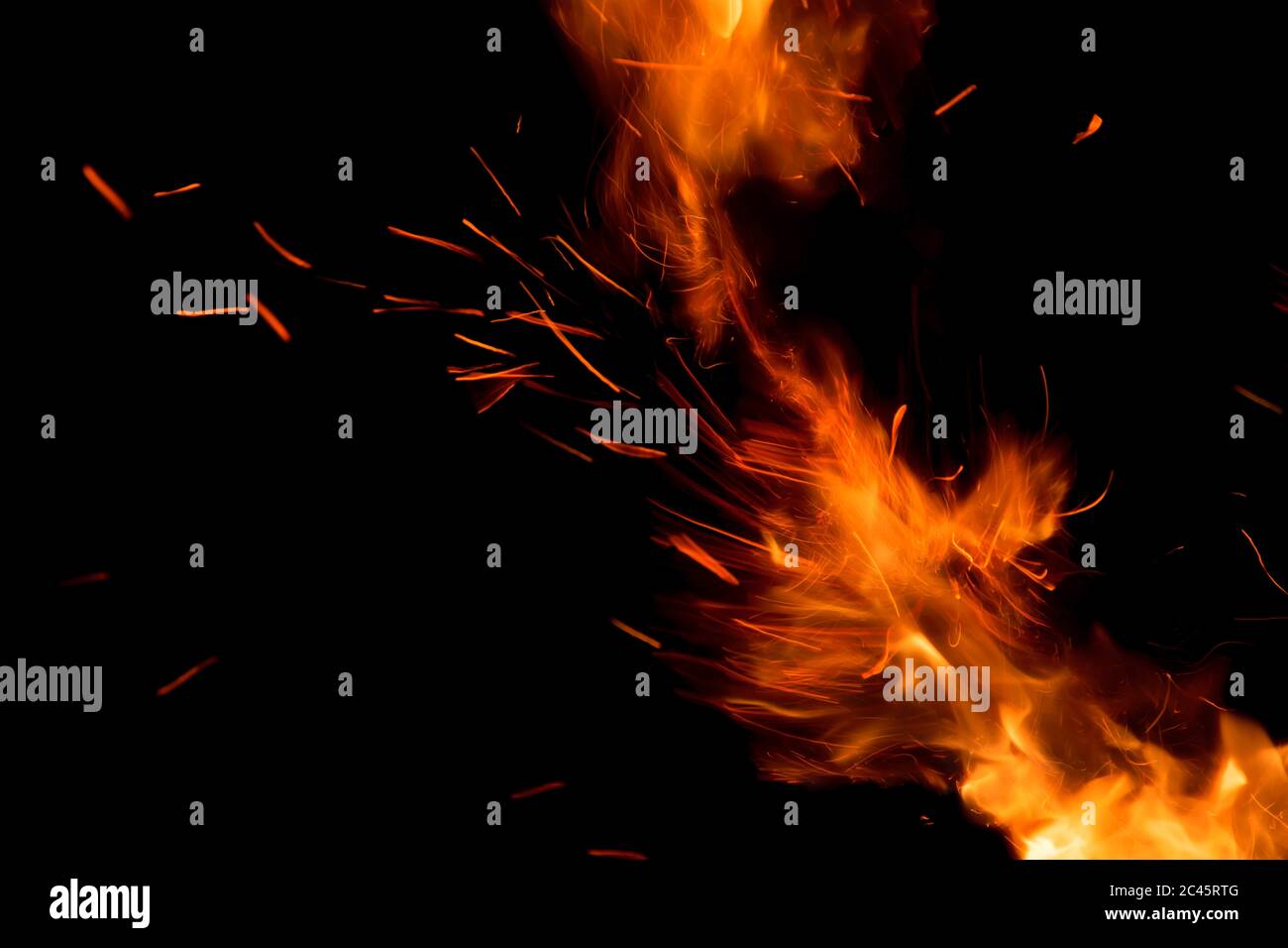 Closeup shot of fire flames glowing in the dark Stock Photo - Alamy
