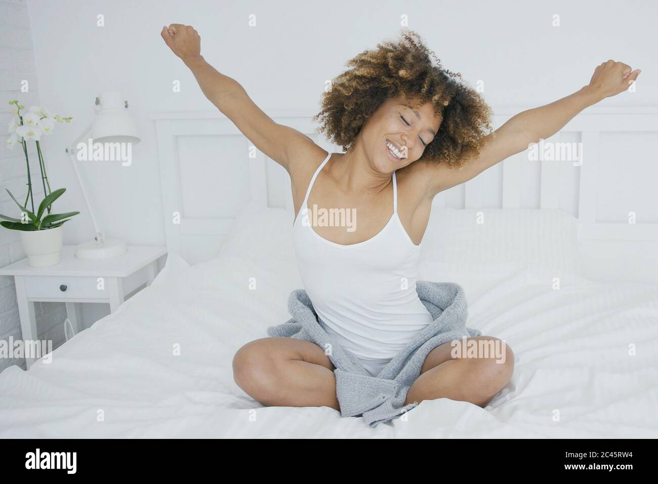 Content woman awaking in morning Stock Photo - Alamy