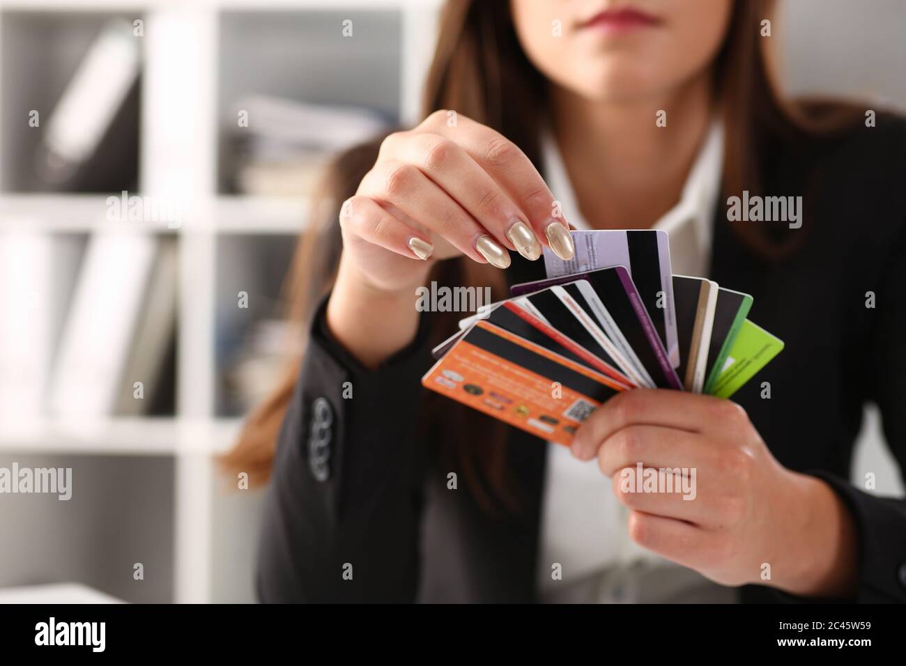 Young woman hands holding various bank cards Stock Photo - Alamy