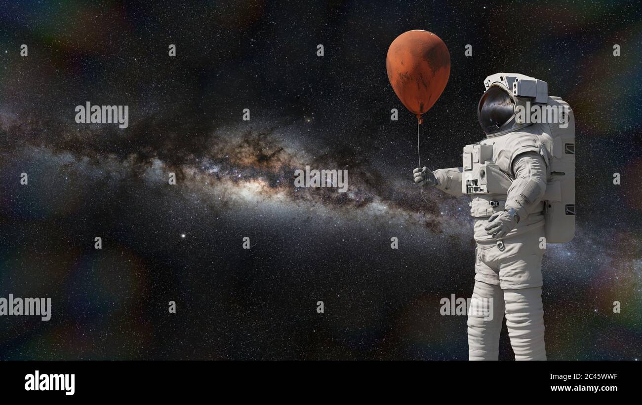 astronaut with Mars balloon in front of the galaxy in empty space Stock ...