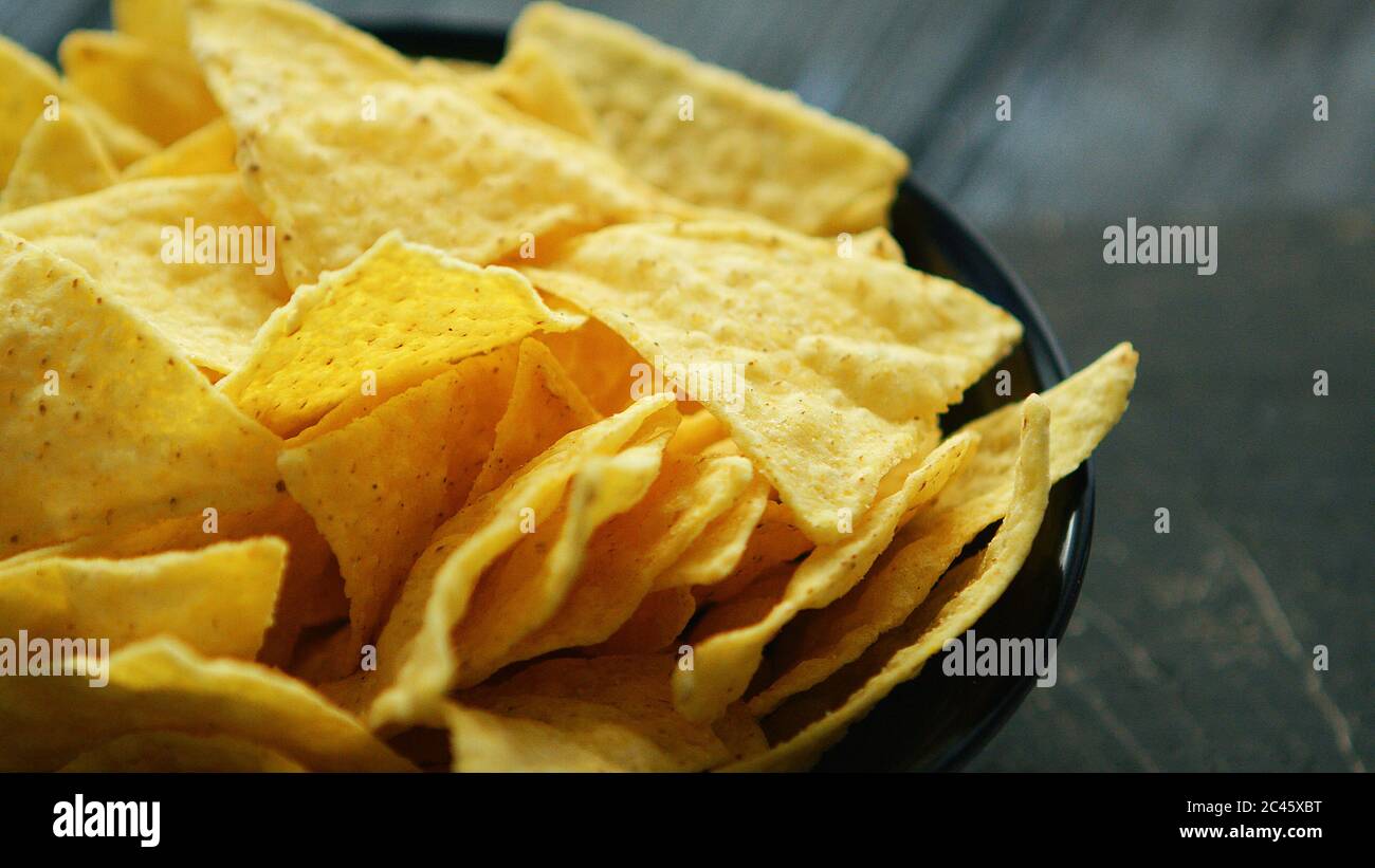 Plate full of nachos Stock Photo - Alamy