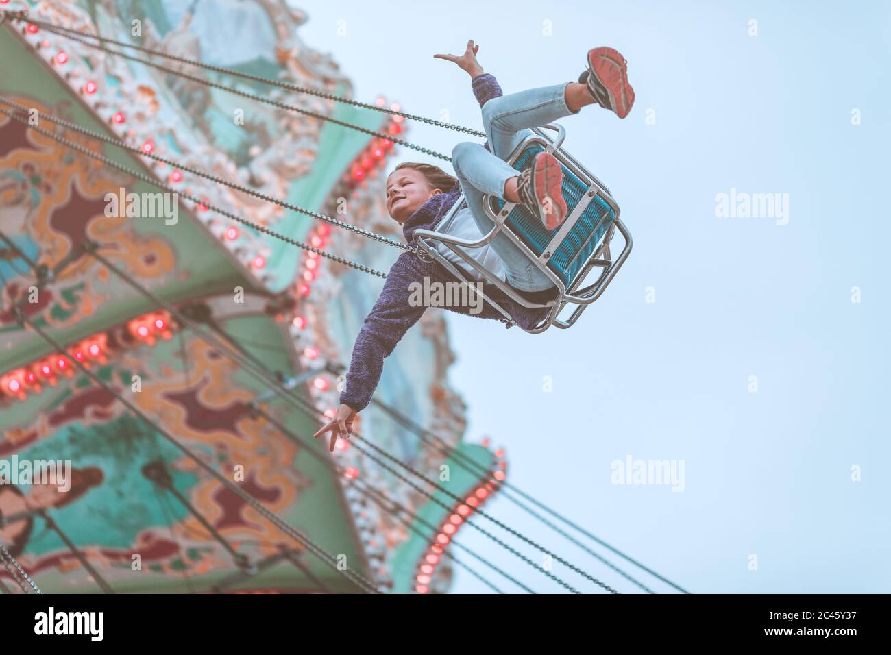 Girl riding on merry go round hi-res stock photography and images - Alamy