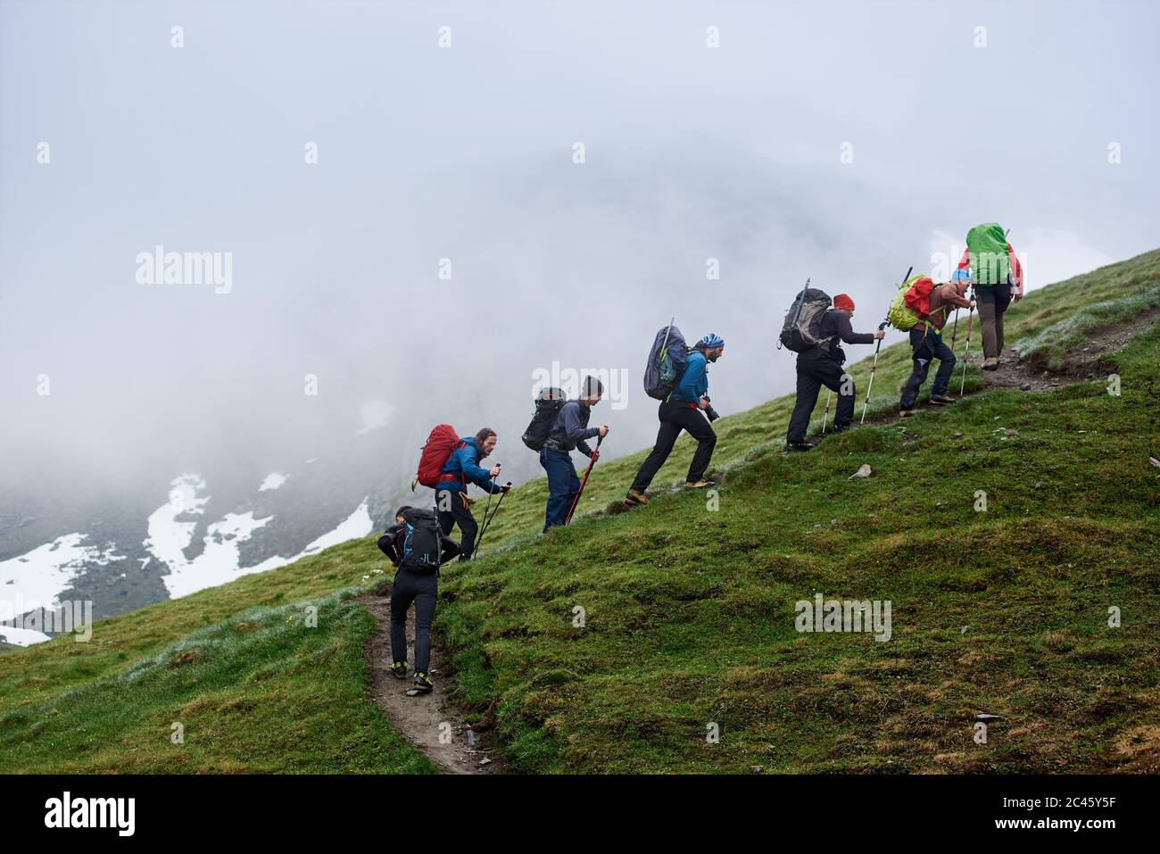 Group of people walking uphill hi-res stock photography and images - Alamy