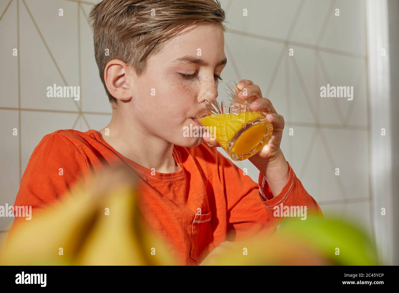 Boy drinking fresh orange juice hi-res stock photography and images - Alamy