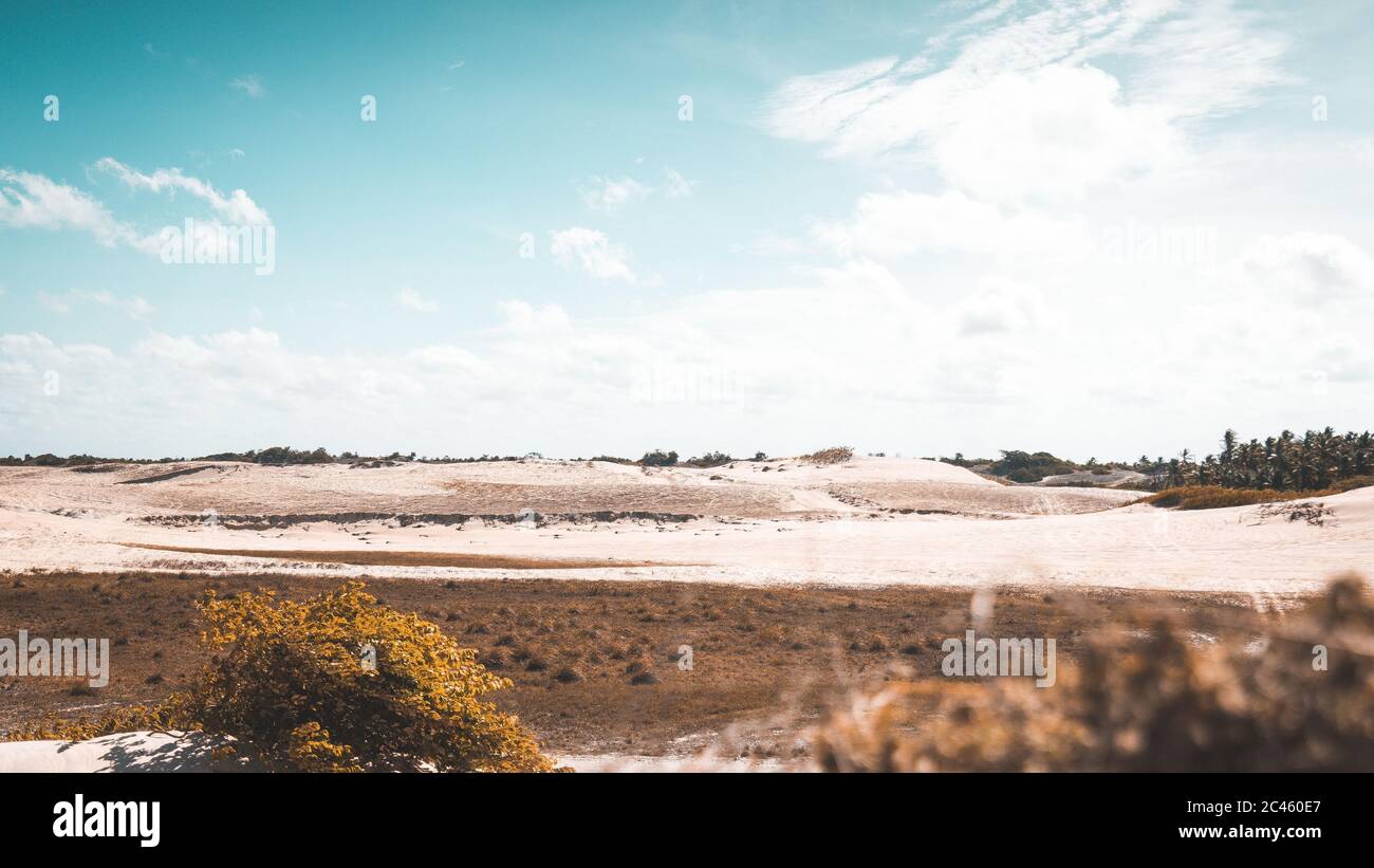 Beautiful scenery of sand dunes on the beach under a cloudy sky Stock ...