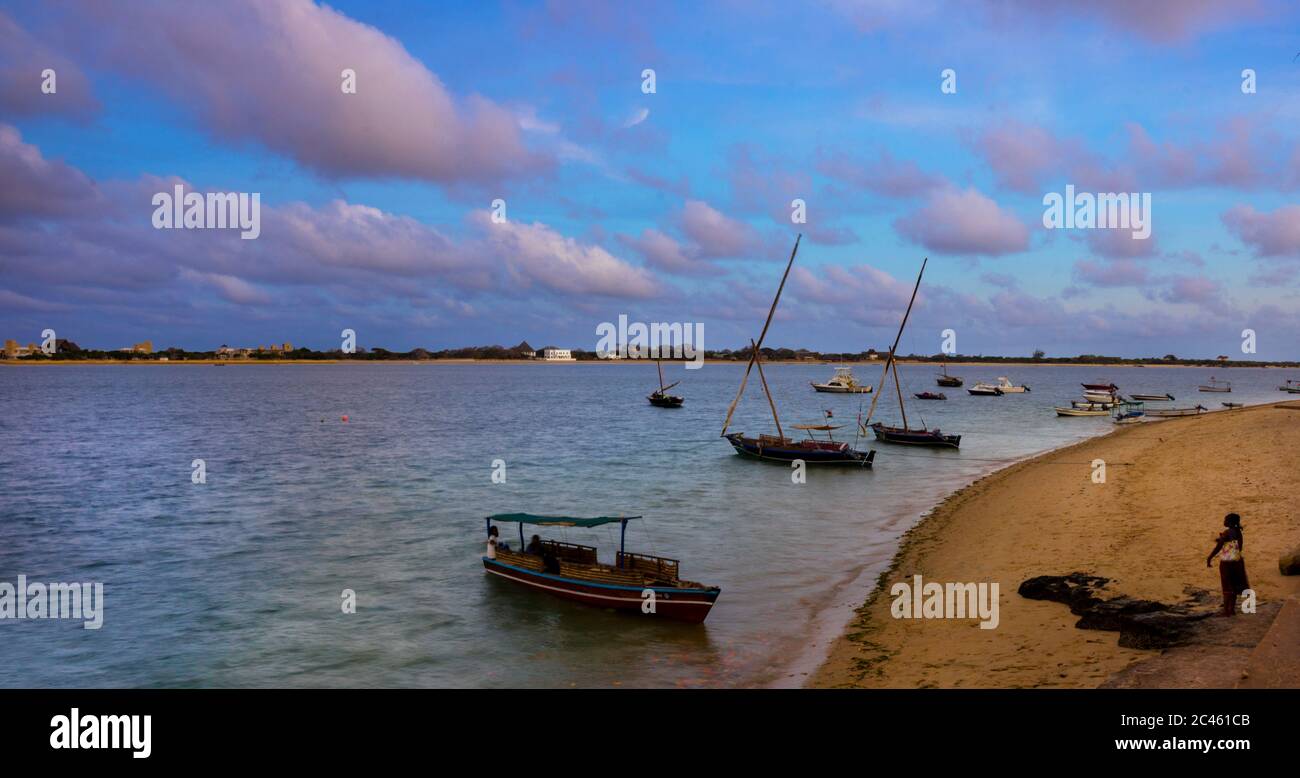 Houses, Hotels and boats on the waterfront at twilight, Lamu county ...
