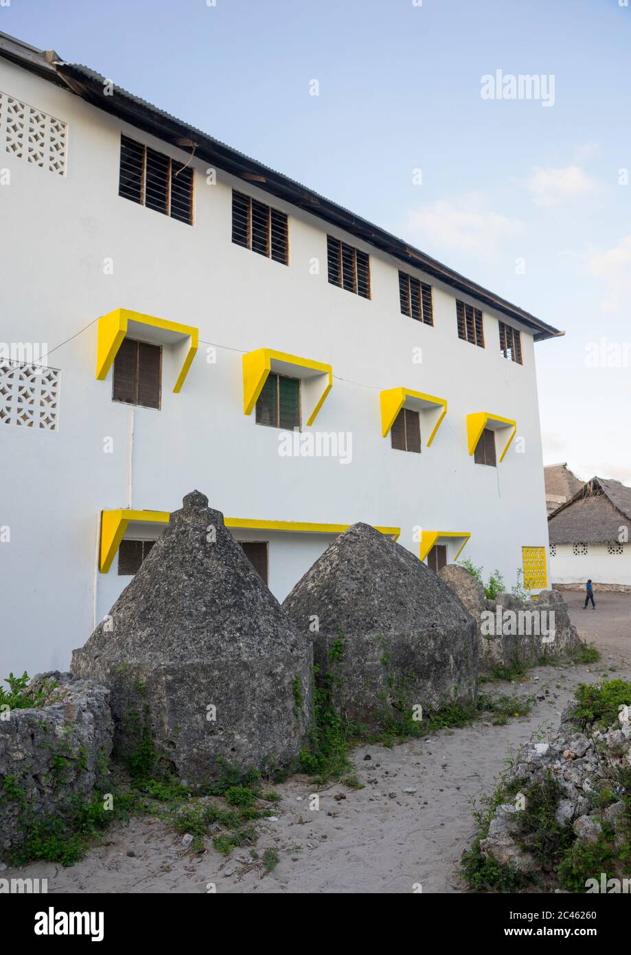 Old muslim graves in front of a modern building, Lamu county, Matondoni ...