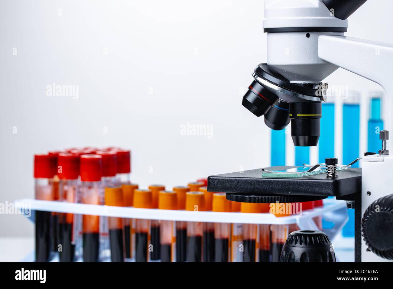Microscope with test tubes for research close up Stock Photo - Alamy