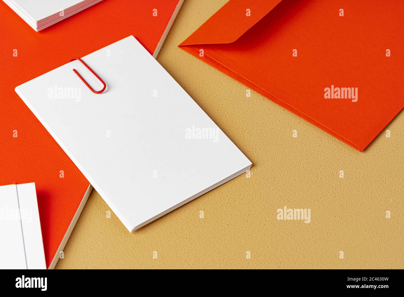 Red and white blank branding paper on beige background Stock Photo - Alamy