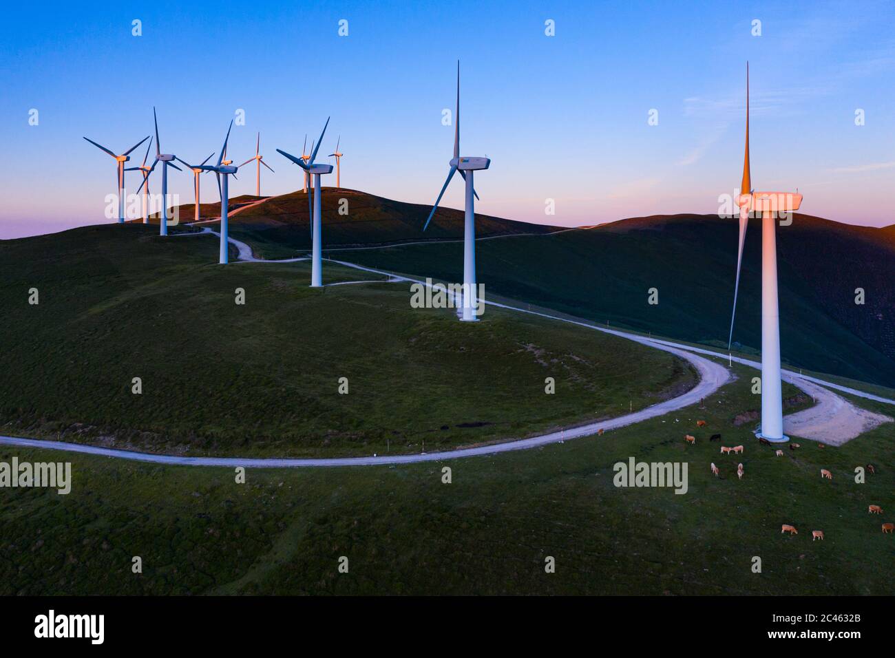 Wind farm at sunset with a drone in Portillo de la Sia between the ...