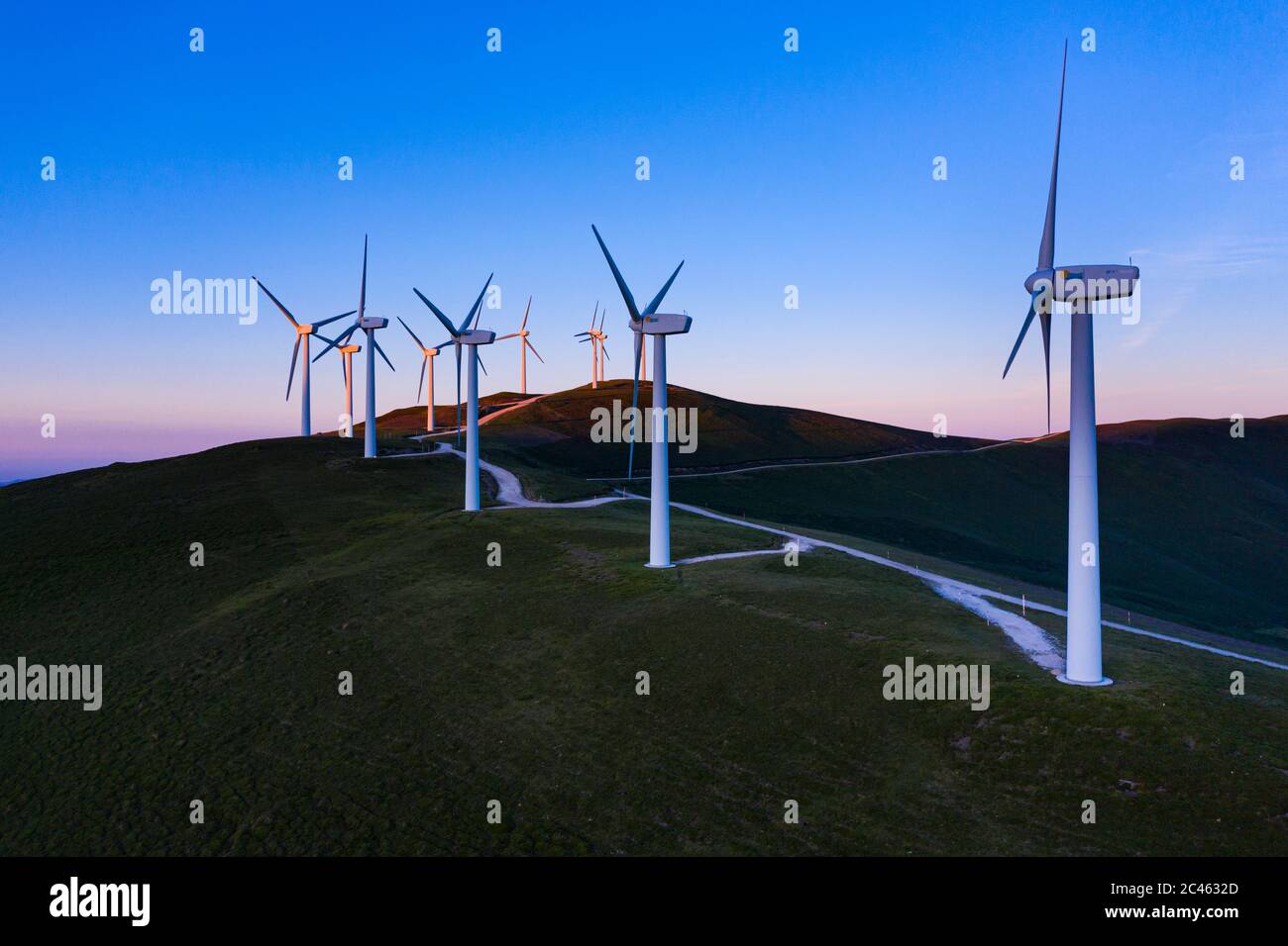Wind farm at sunset with a drone in Portillo de la Sia between the ...