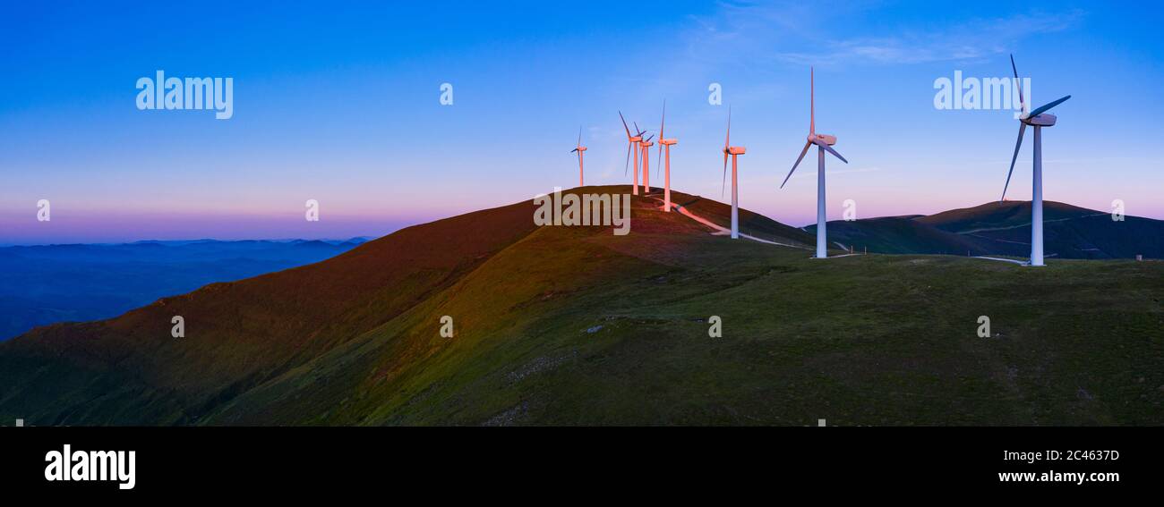 Wind farm at sunset with a drone in Portillo de la Sia between the ...