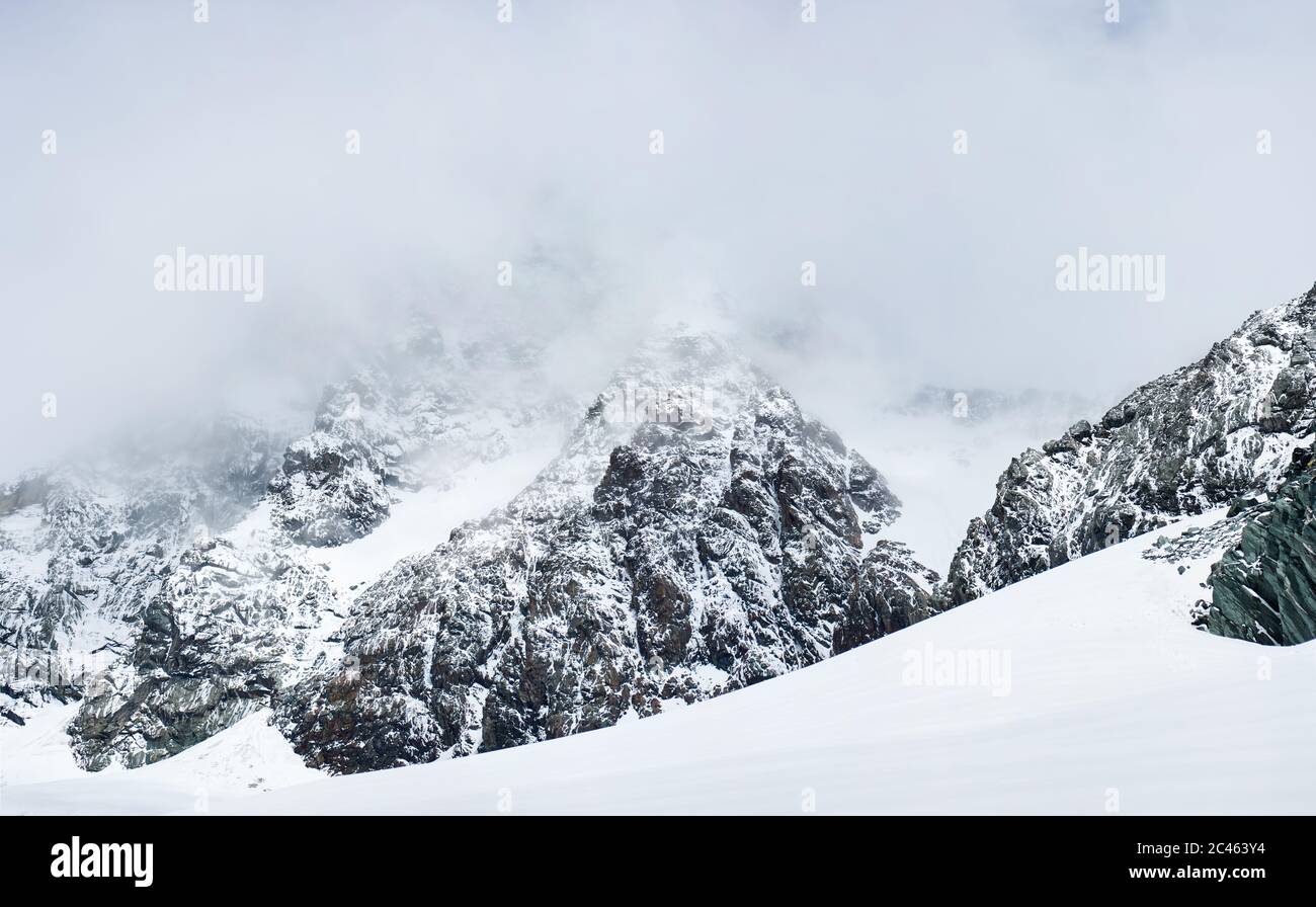 Fantastic scenery of rocky mountains covered with snow. Panoramic view ...