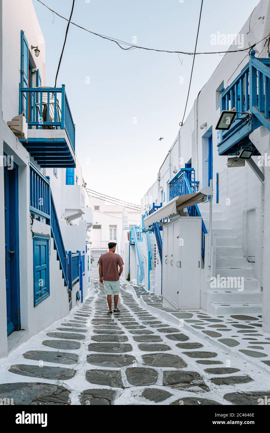 young guy on vacation at the Greek Island of Mykonos, men relaxing at ...