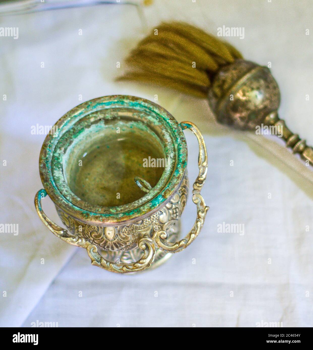 inside the church water blessed by the priest ready for baptism ...