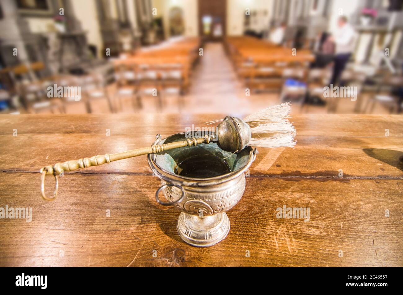 inside the church water blessed by the priest ready for baptism ...
