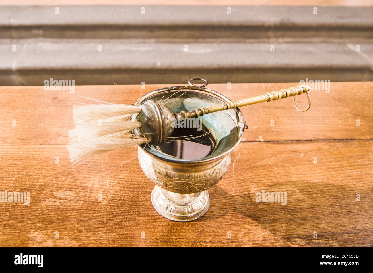 inside the church water blessed by the priest ready for baptism ...