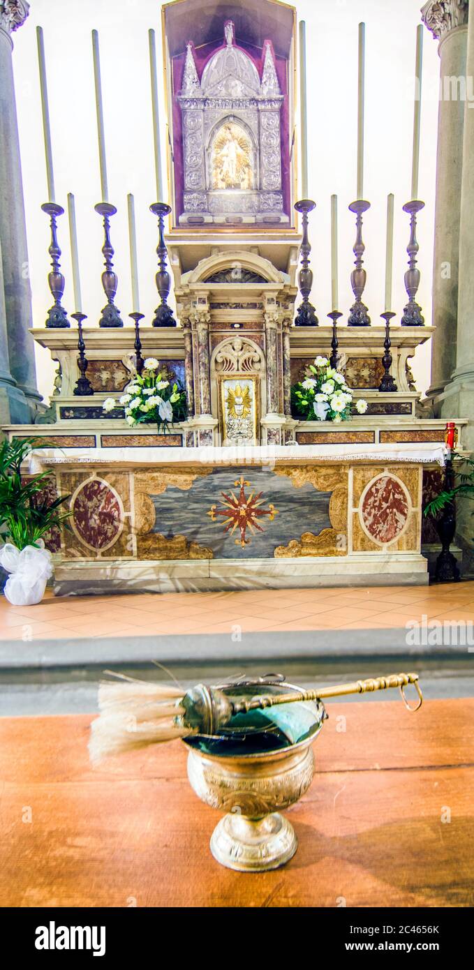 inside the church water blessed by the priest ready for baptism ...