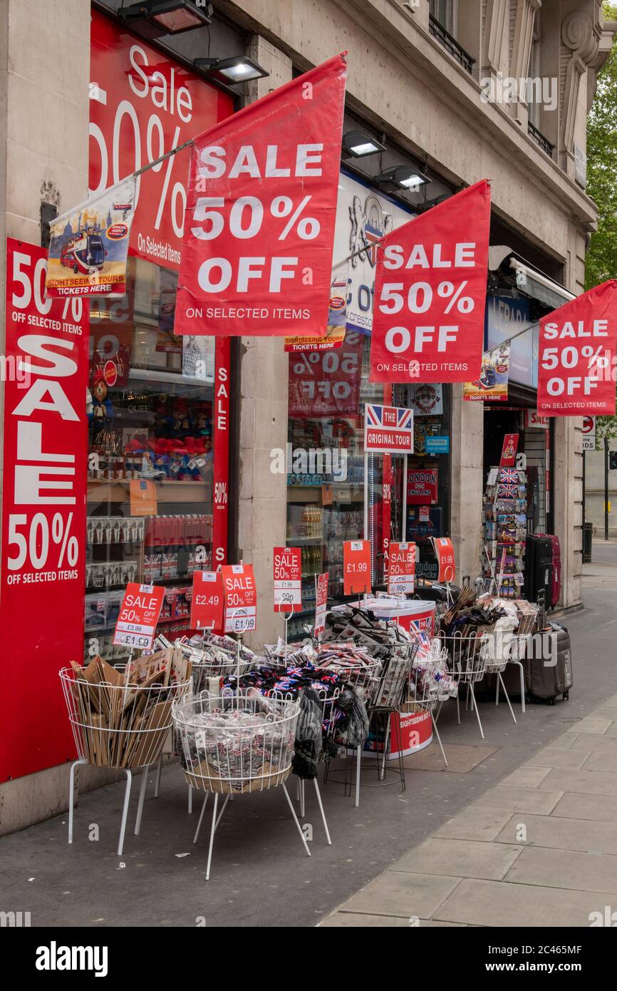 Sale signs in shop on street Stock Photo - Alamy