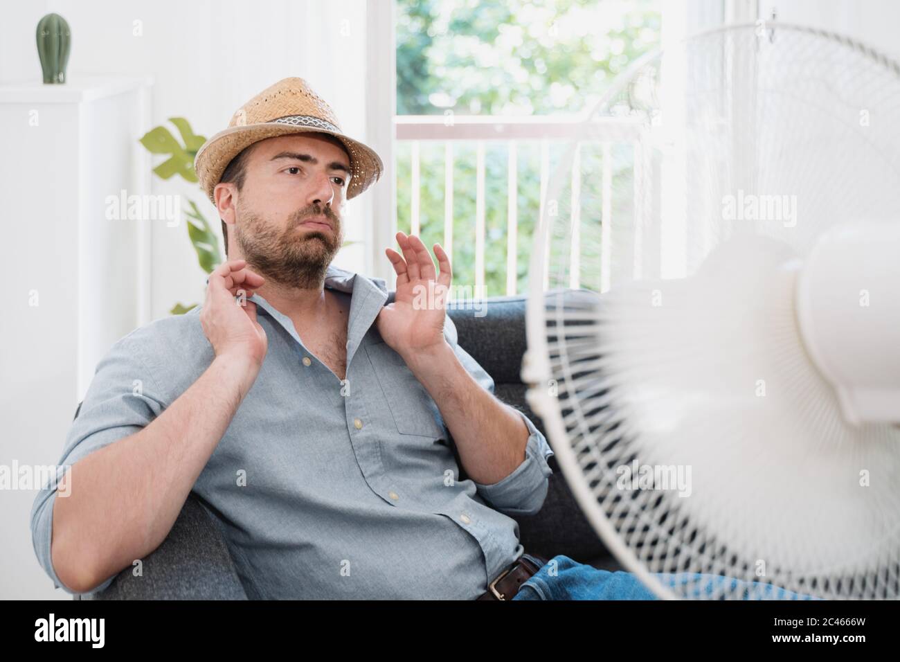 Hot weather man sofa hi-res stock photography and images - Alamy
