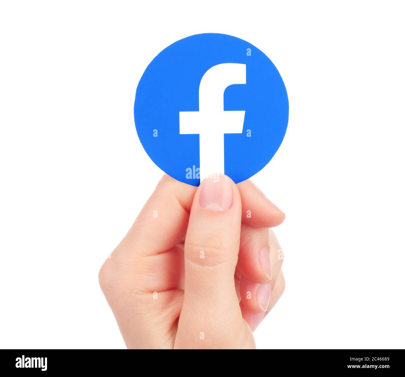 Kiev, Ukraine - May 15, 2019: Hand holds New Facebook logo printed on ...