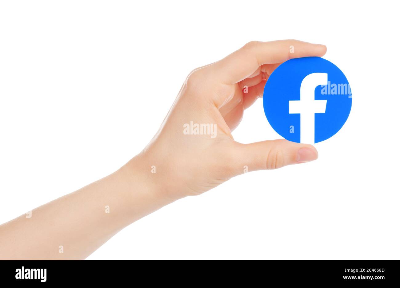 Kiev, Ukraine - May 15, 2019: Hand holds new Facebook logo printed on ...