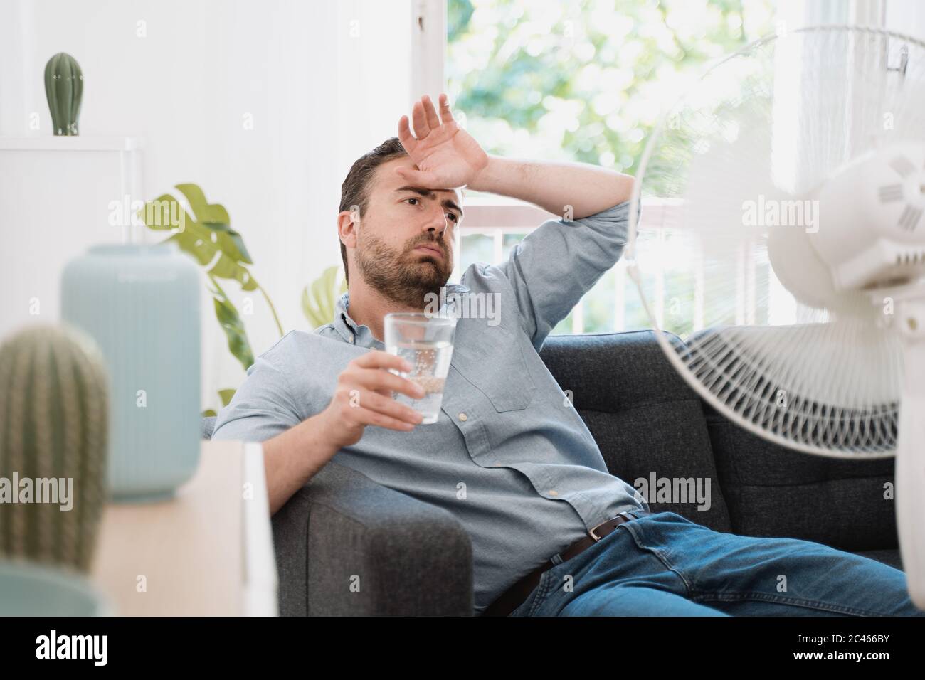 Hot weather man sofa hi-res stock photography and images - Alamy