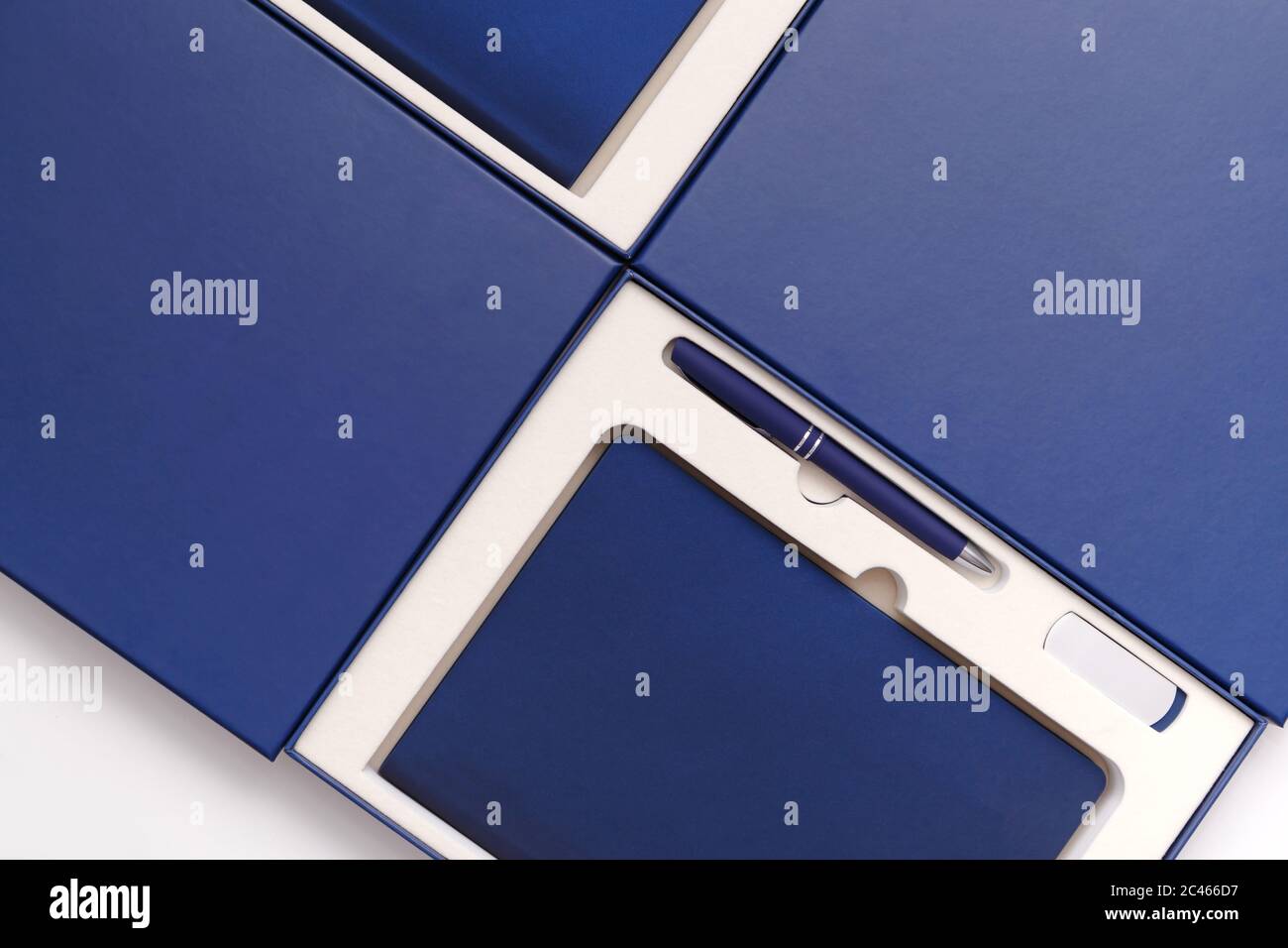 Corporate style box with pen, flash drive and notebook isolated on ...