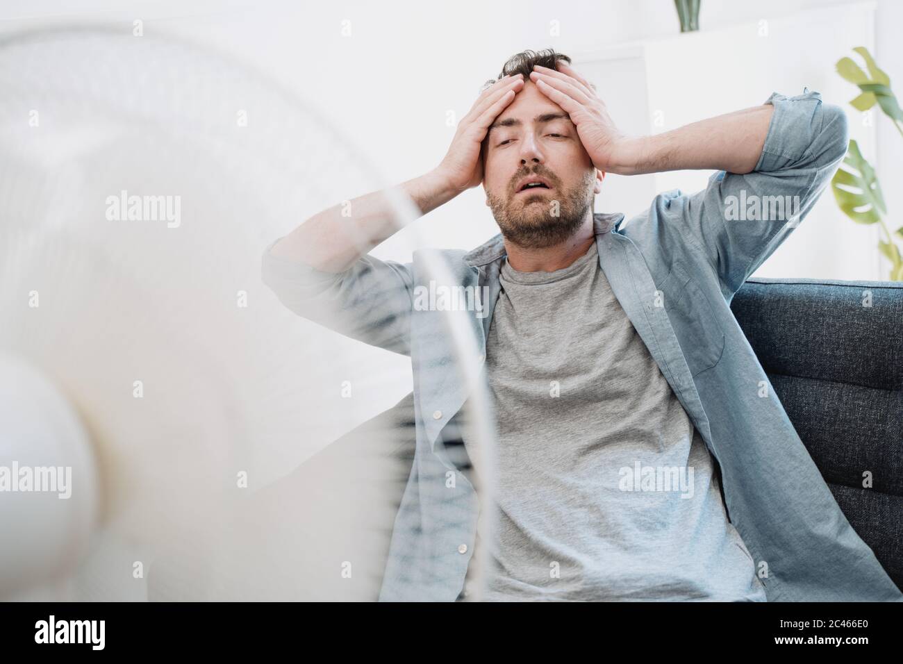 Hot Weather Man Sofa High Resolution Stock Photography and Images - Alamy