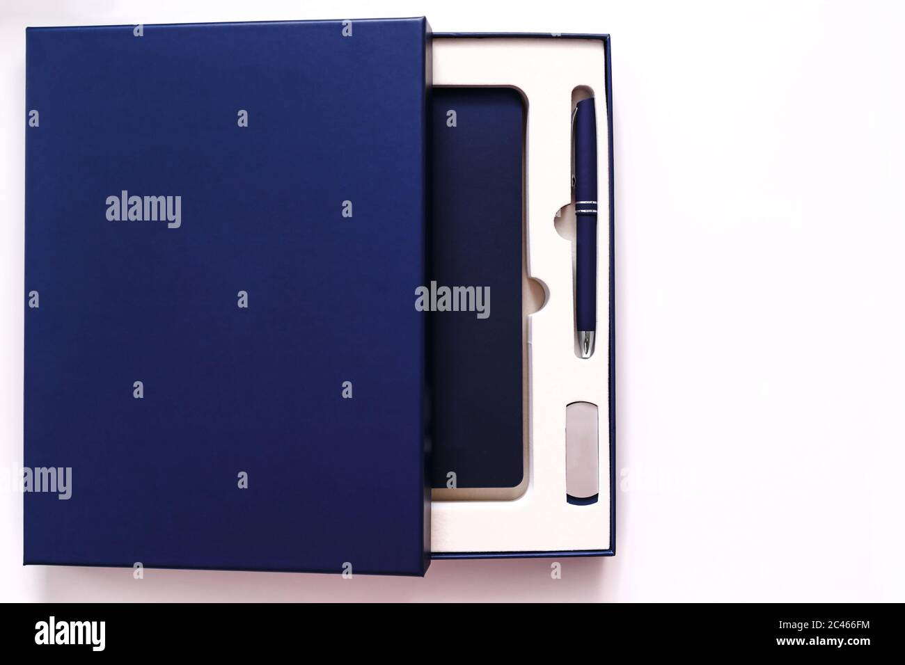 Corporate style box with pen, flash drive and notebook isolated on ...