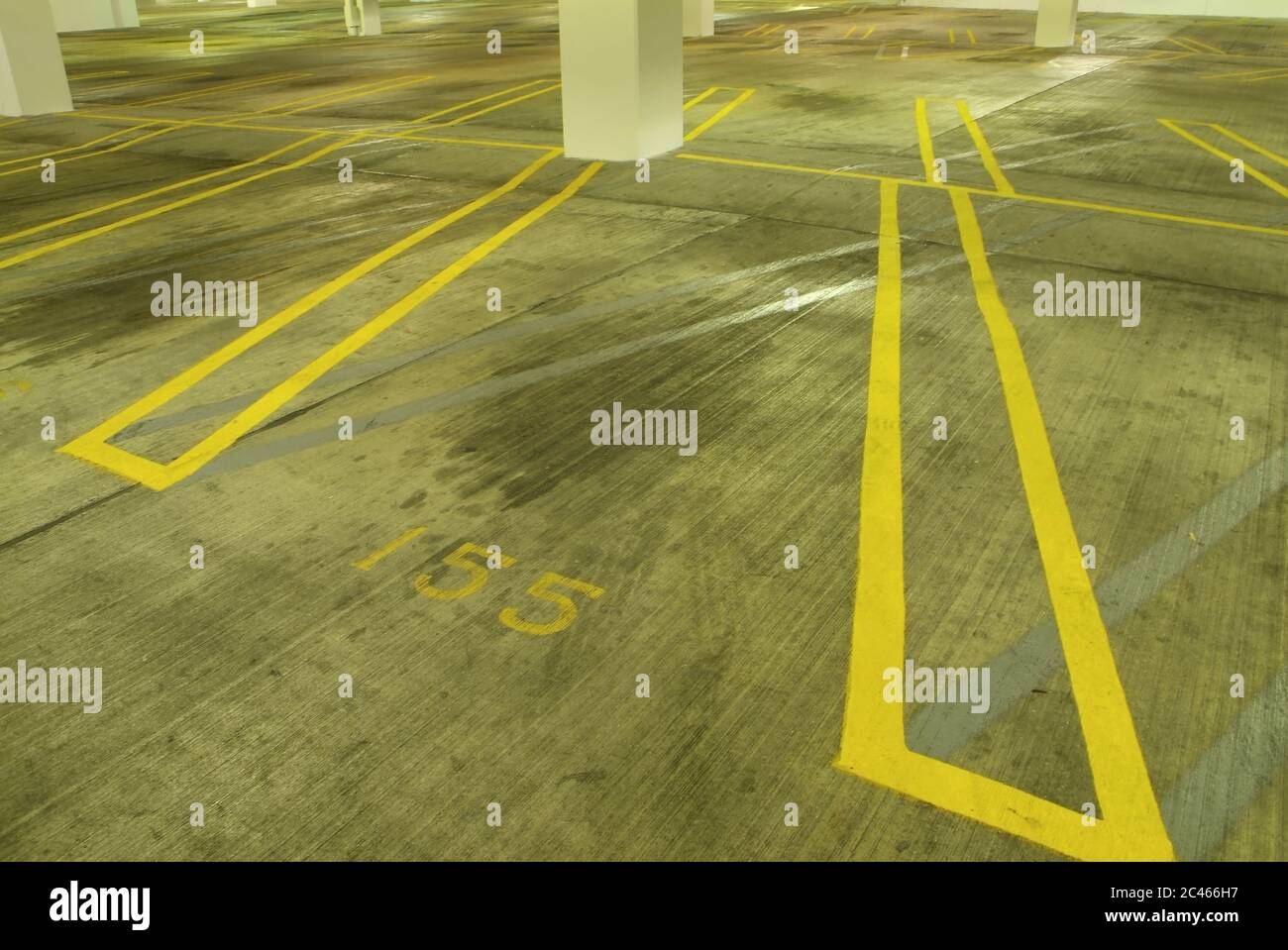 Shot of an underground parking lot with yellow and gray lines in ...