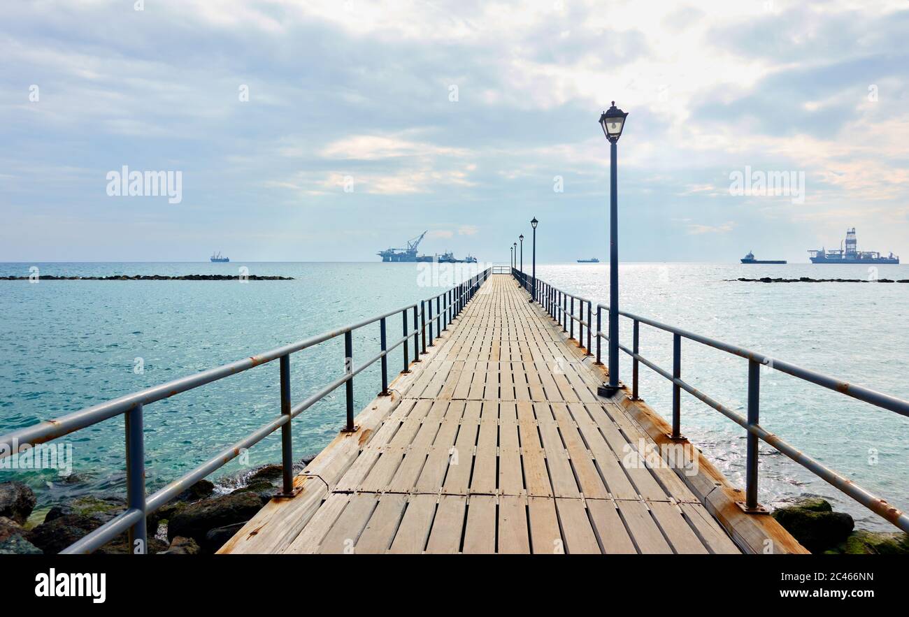 Perspective of the long walking pier by the sea in Limassol, Cyprus ...
