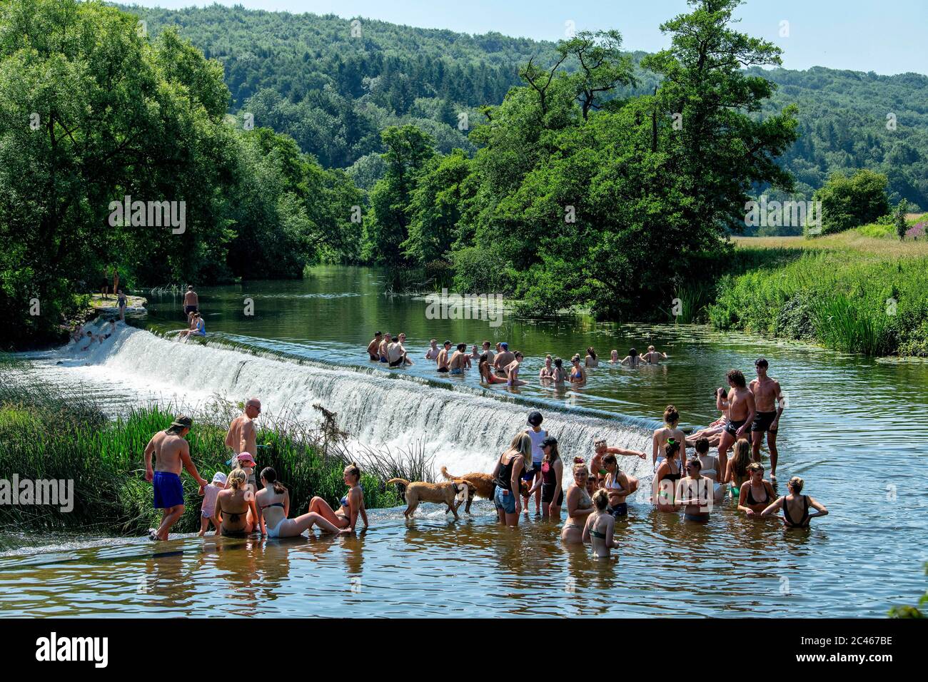 People enjoy the water at Warleigh Weir on the river Avon near Bath as ...