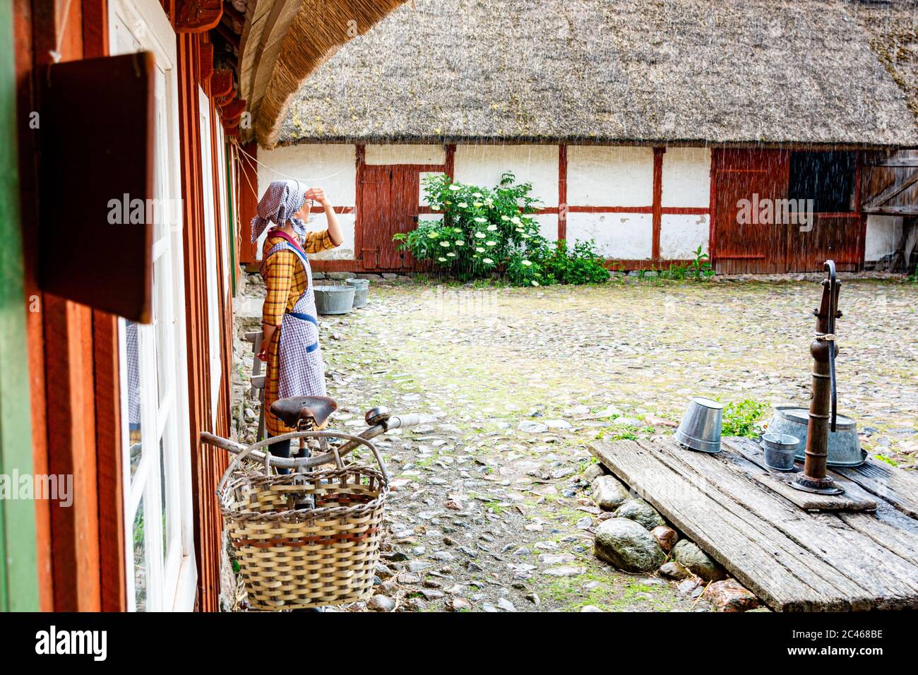 STOCKHOLM, SWEDEN - Jun 18, 2019: Girl on a traditional Swedish farm ...