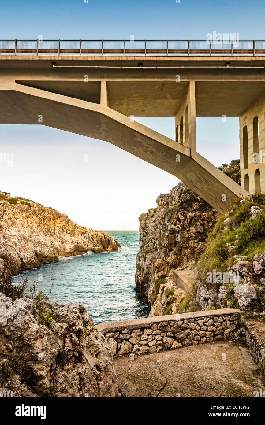 The Ciolo bridge connects two high cliffs. An inlet of the sea, in ...